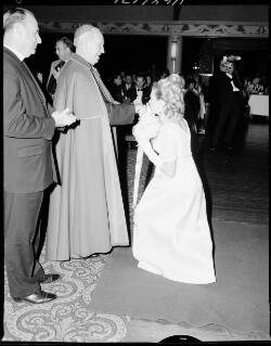 A woman greeting Cardinal Norman Gilroy at the Catholic Youth ...