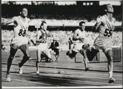 Bobby Morrow wins a second gold medal during the 200 metres final, team ...