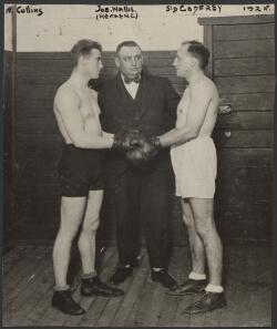 Boxers Harry Collins and Sid Godfrey shake hands in front of referee Joe Wallis [picture]