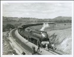 [Western Endeavour train, with passengers stopping to take photographs ...